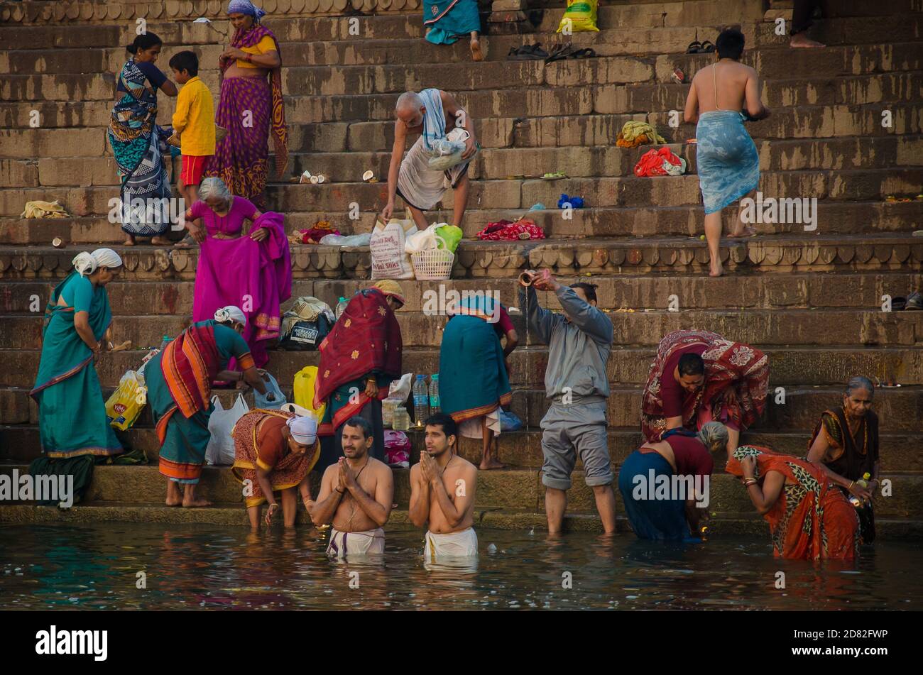 Washing in the Ganges River at dawn in India Stock Photo - Alamy