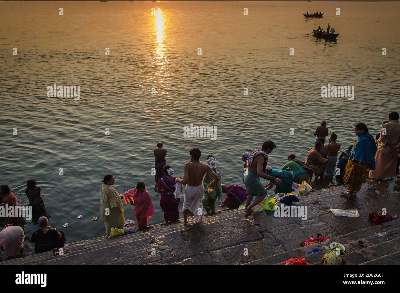 Washing in the Ganges River at dawn in India Stock Photo - Alamy