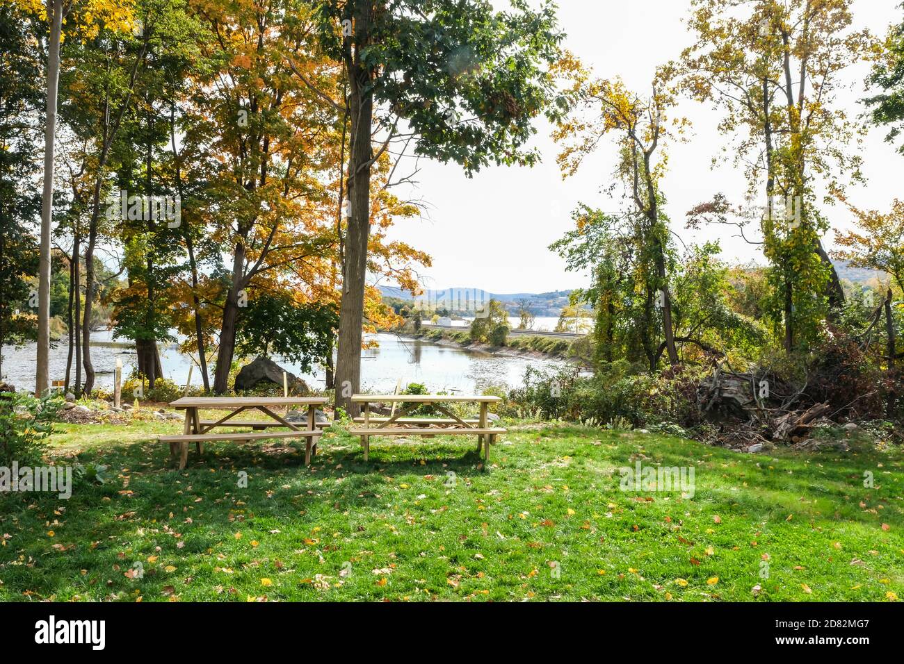 Picnic tables in the park during fall Stock Photo - Alamy