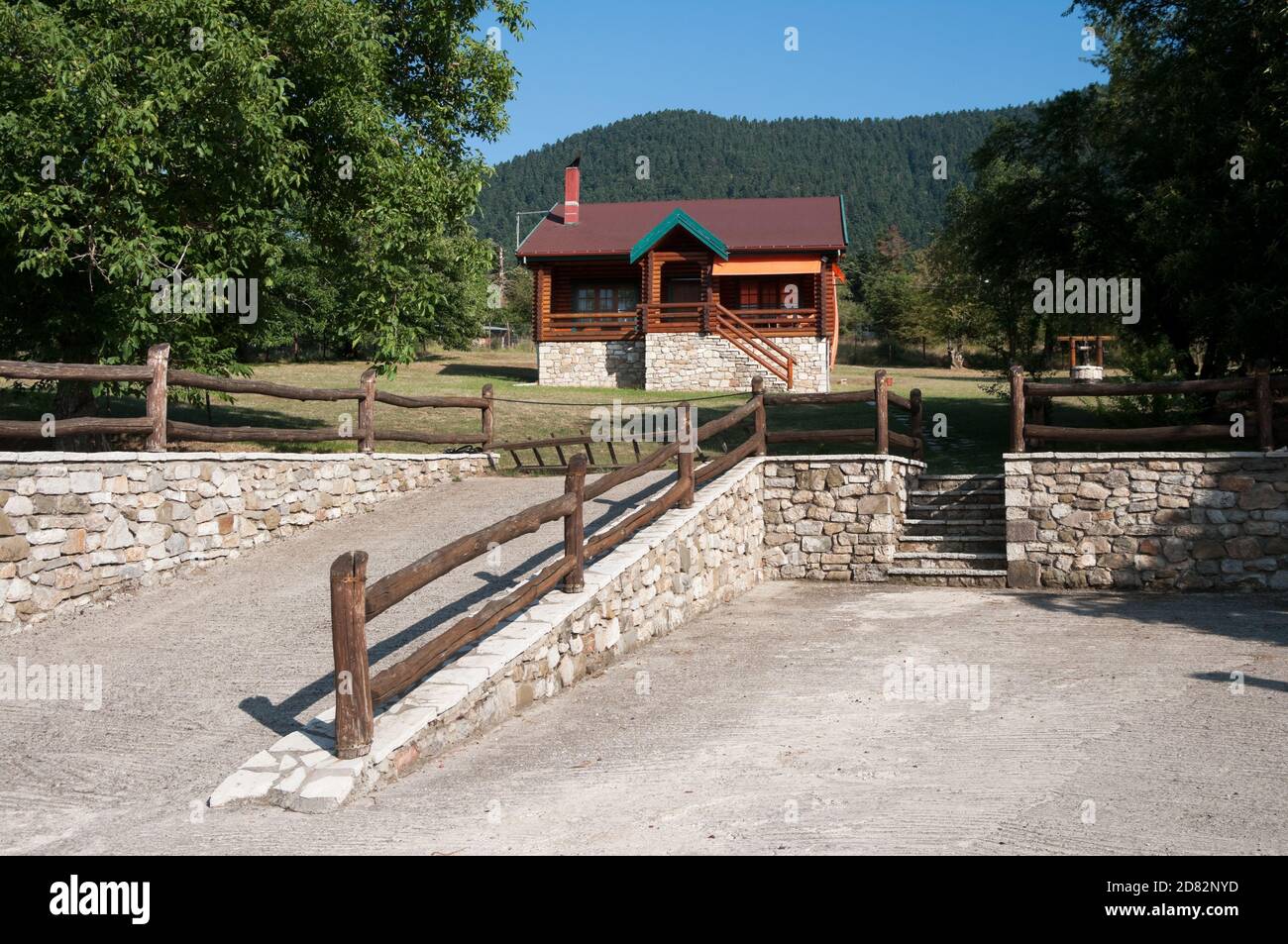 front view of log cabin in land considered the Swiss Alps of Greece ...