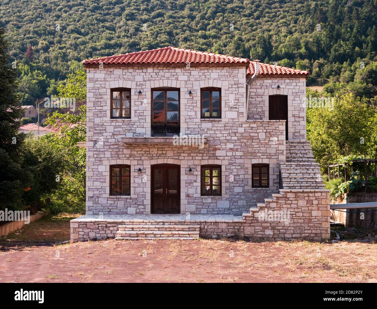 traditional stone house new in Greece Stock Photo - Alamy