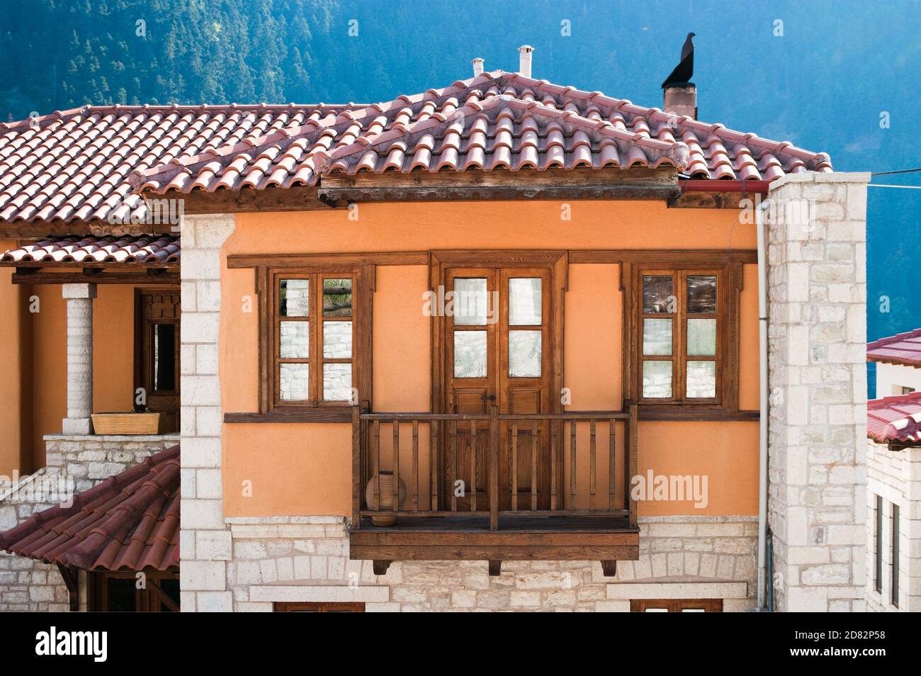 traditional stone house with wood balcony in Korishades, Greece Stock ...