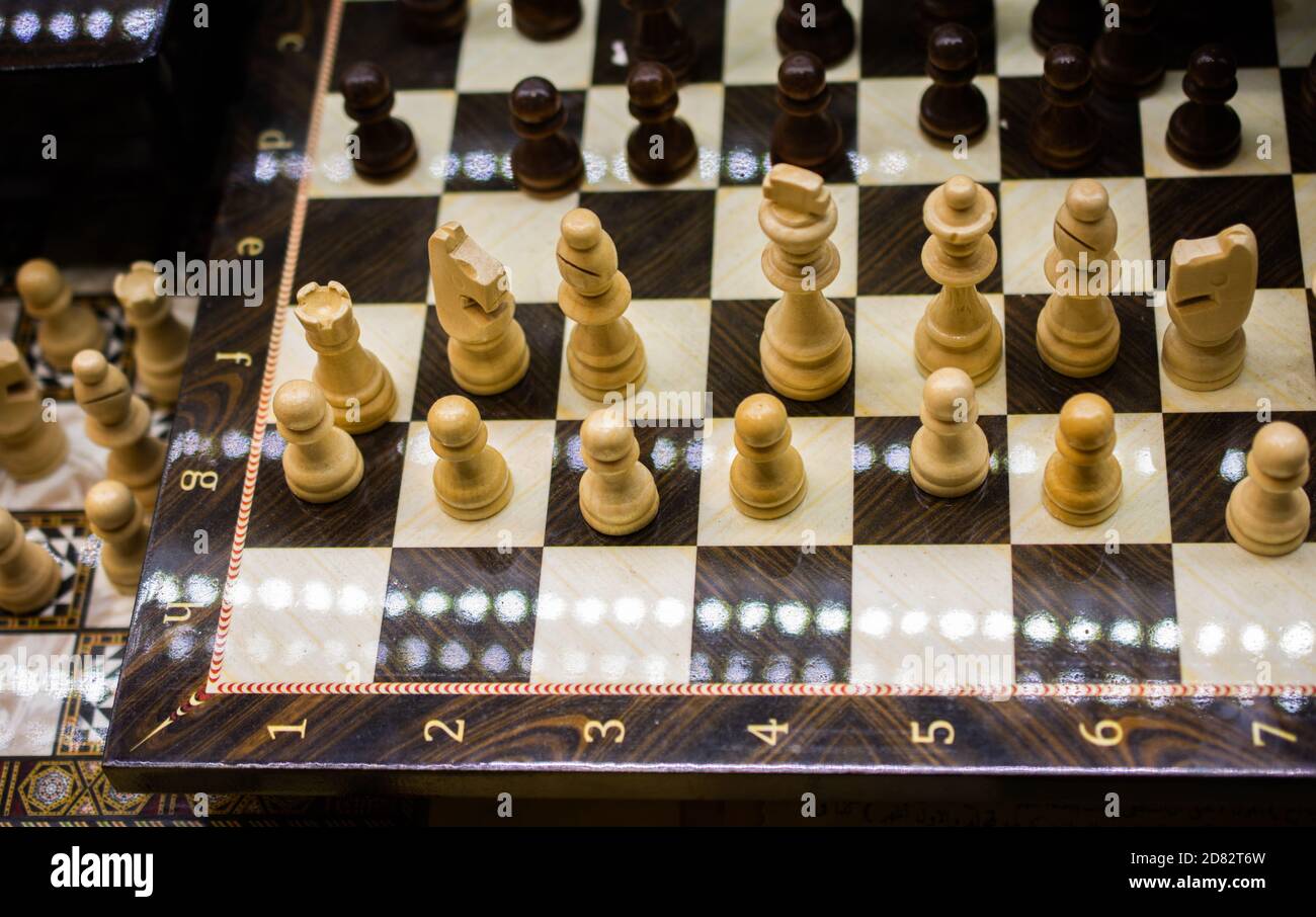Intellectual game -chess. Wooden chess pieces on the chessboard Stock ...