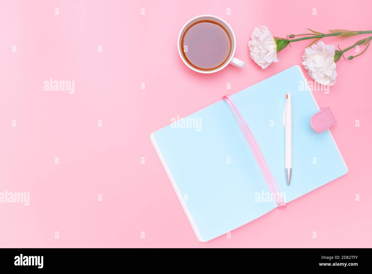 workspace desk styled design office supplies, hot tea and white flower ...