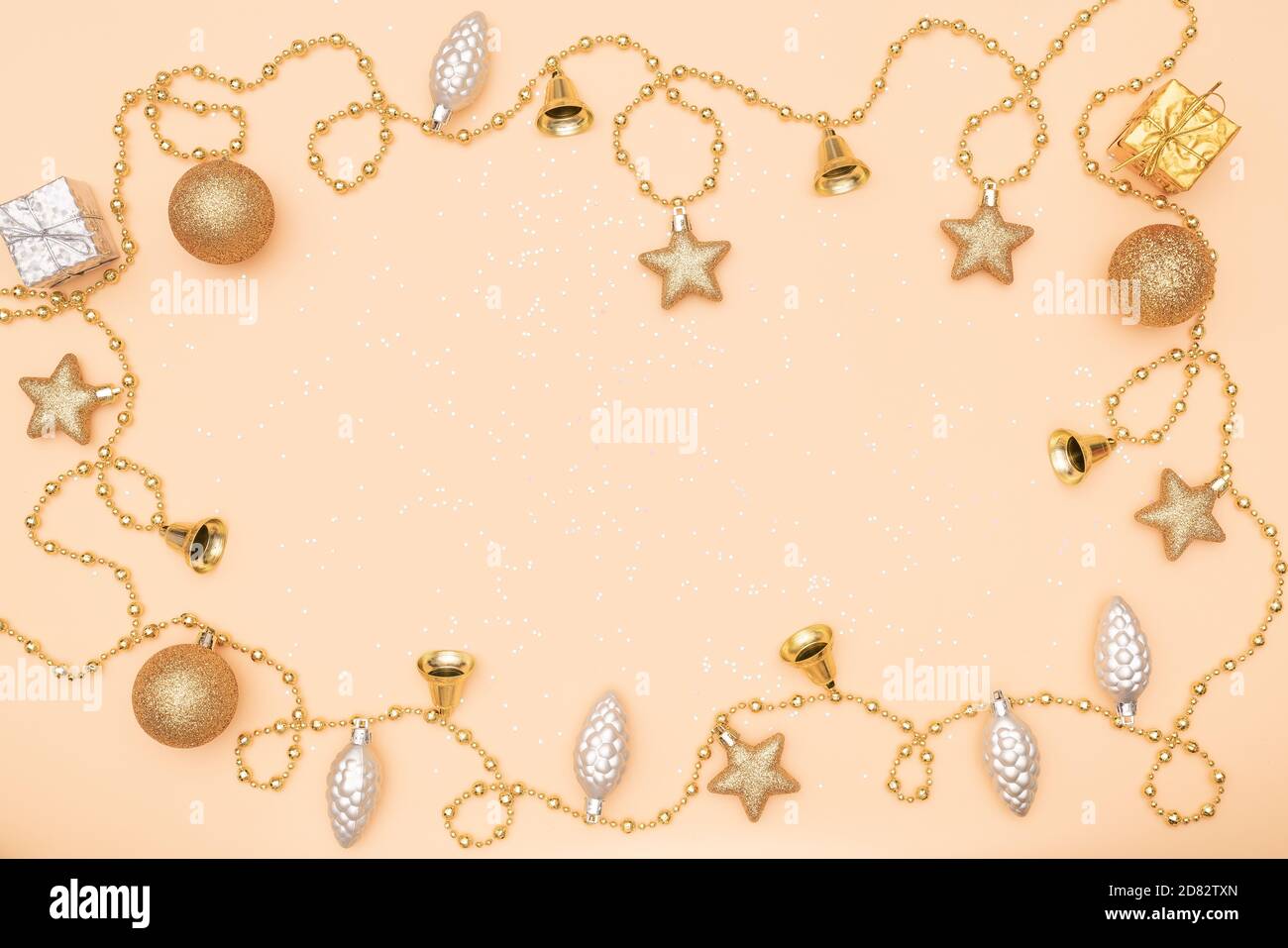 gift box or present box with golden star, bell and ball on golden ...