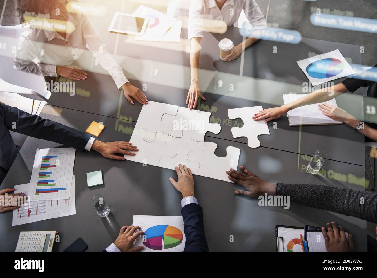 Teamwork of partners. Concept of integration and startup with puzzle ...