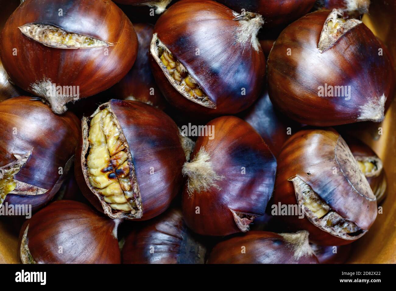 Roasted chestnuts in the plate ready to eat. closeup Stock Photo - Alamy