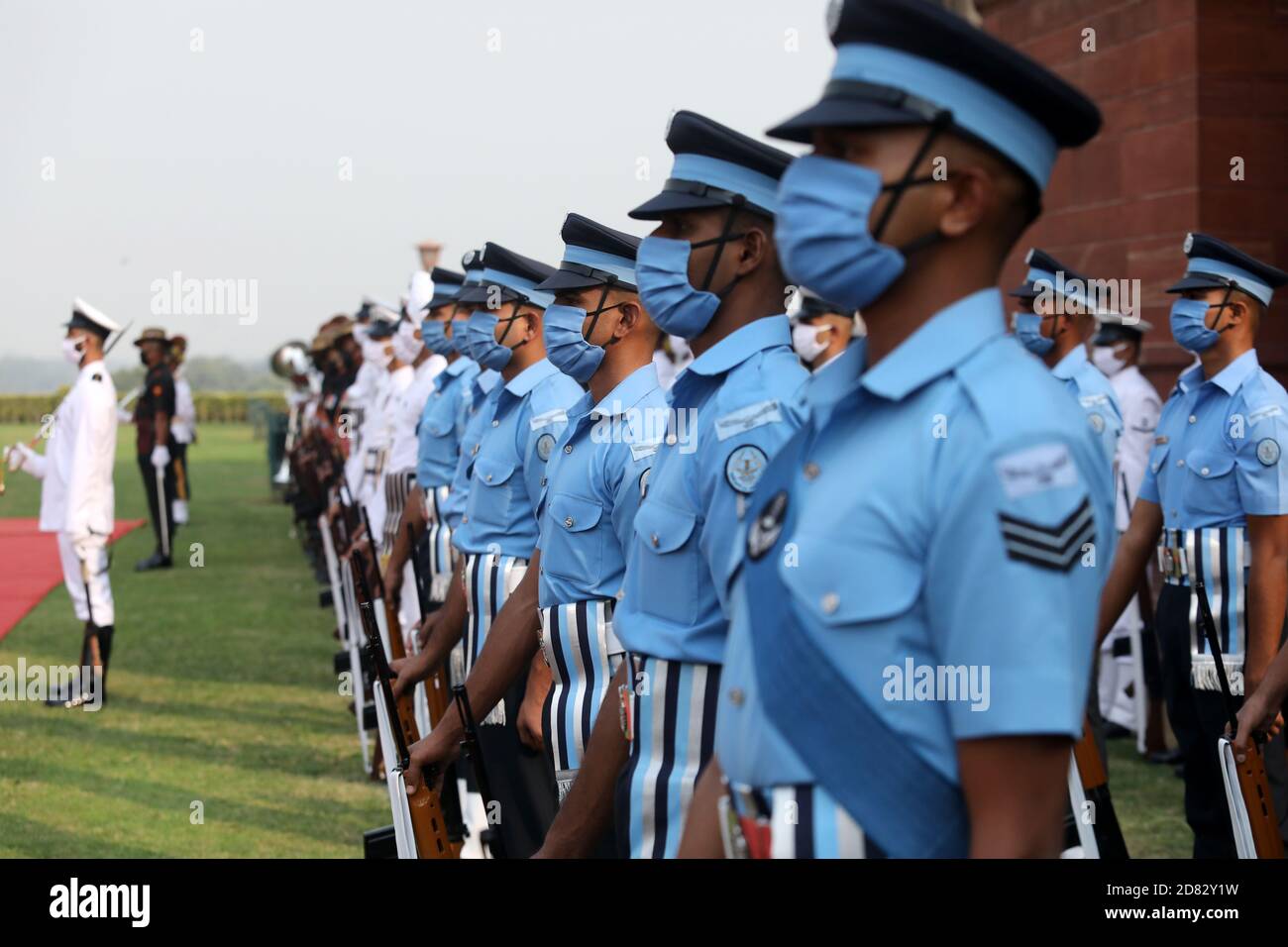 Indian Navy (White) and Army (Olive Greens) wearing face masks take ...