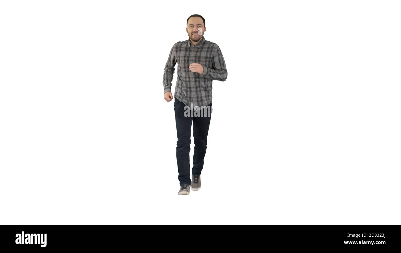 Young man running excited on white background Stock Photo - Alamy