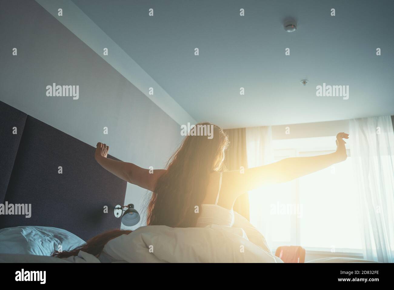 Girl Stretching Arms In Bed High Resolution Stock Photography and ...