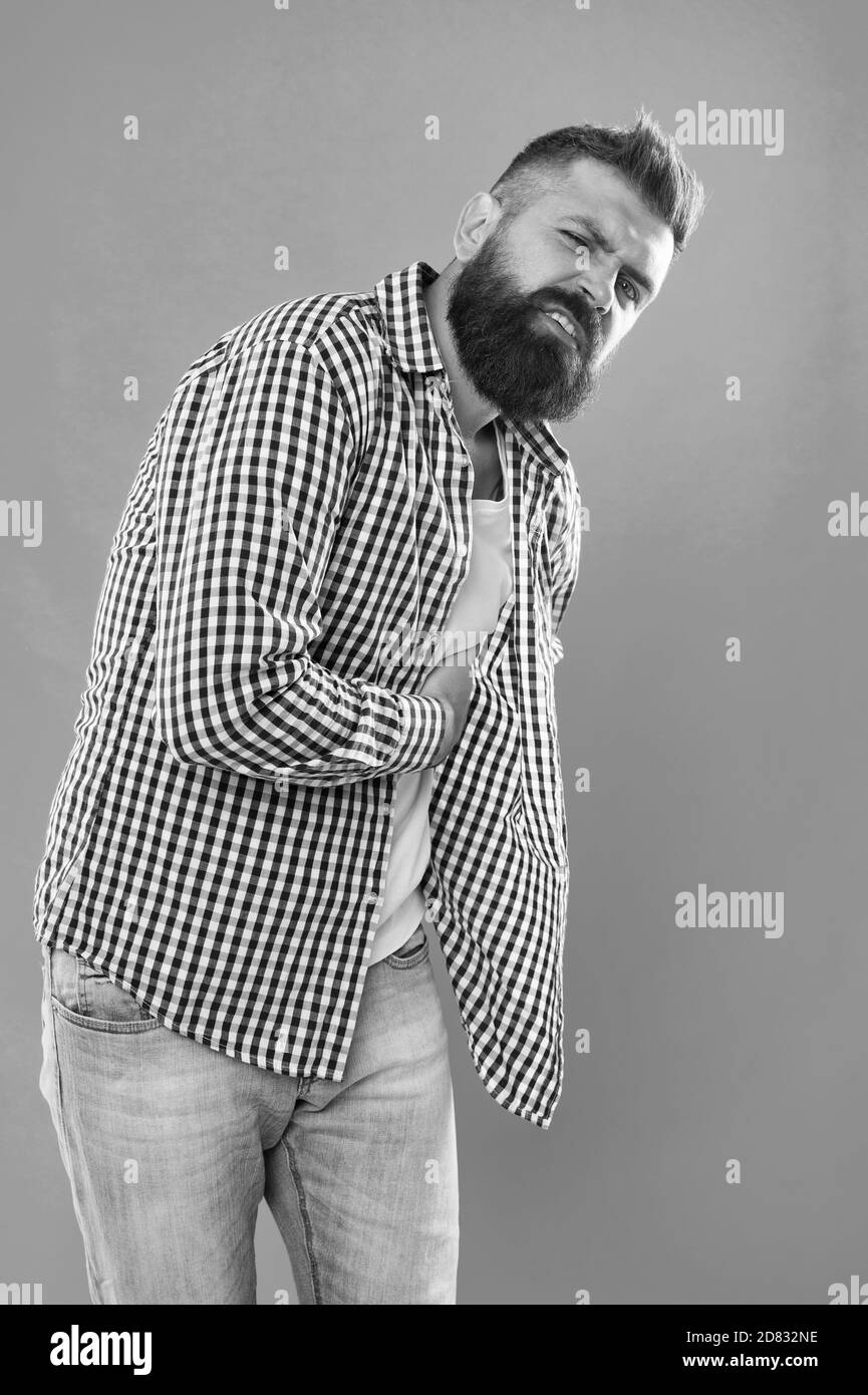 Symptoms of myocardial infarction. Oh my heart. Bearded man suffer from ...