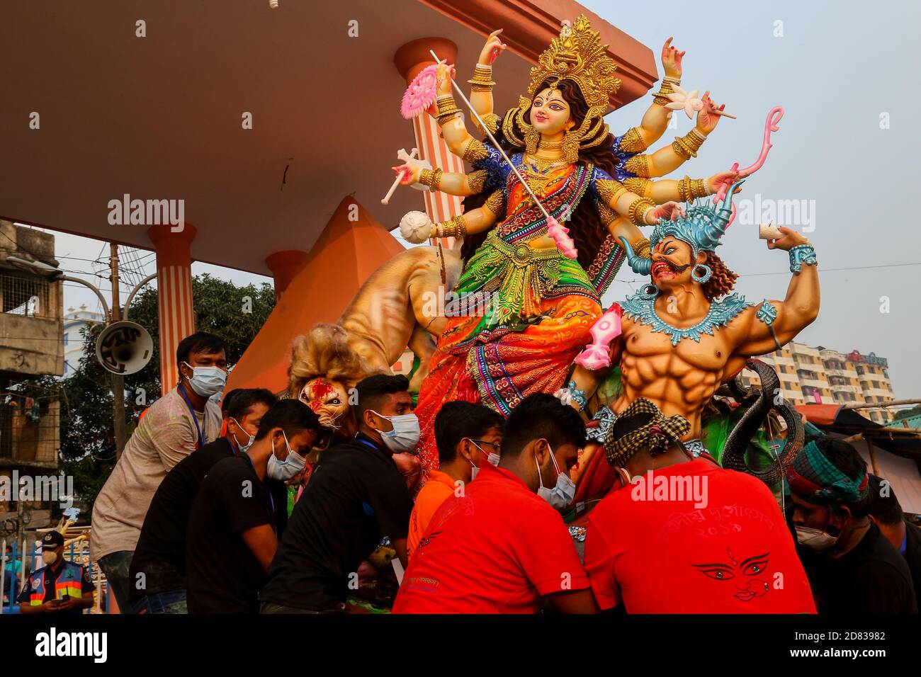 Dhaka, Bangladesh. 26th Oct, 2020. Hindu devotees carry an idol of the ...