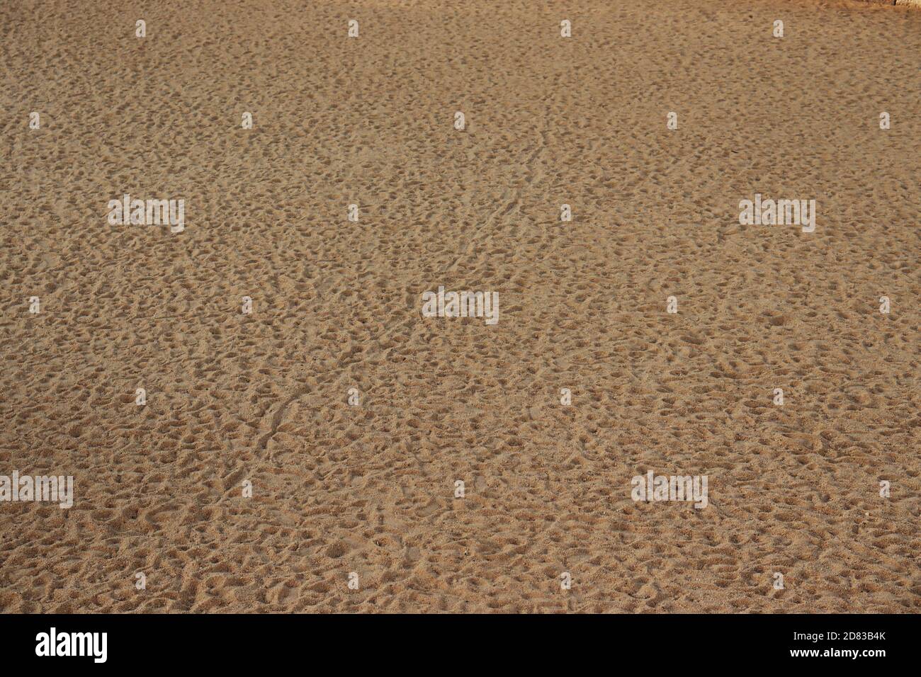 the sandy ground that form patterns from human footprint Stock Photo ...