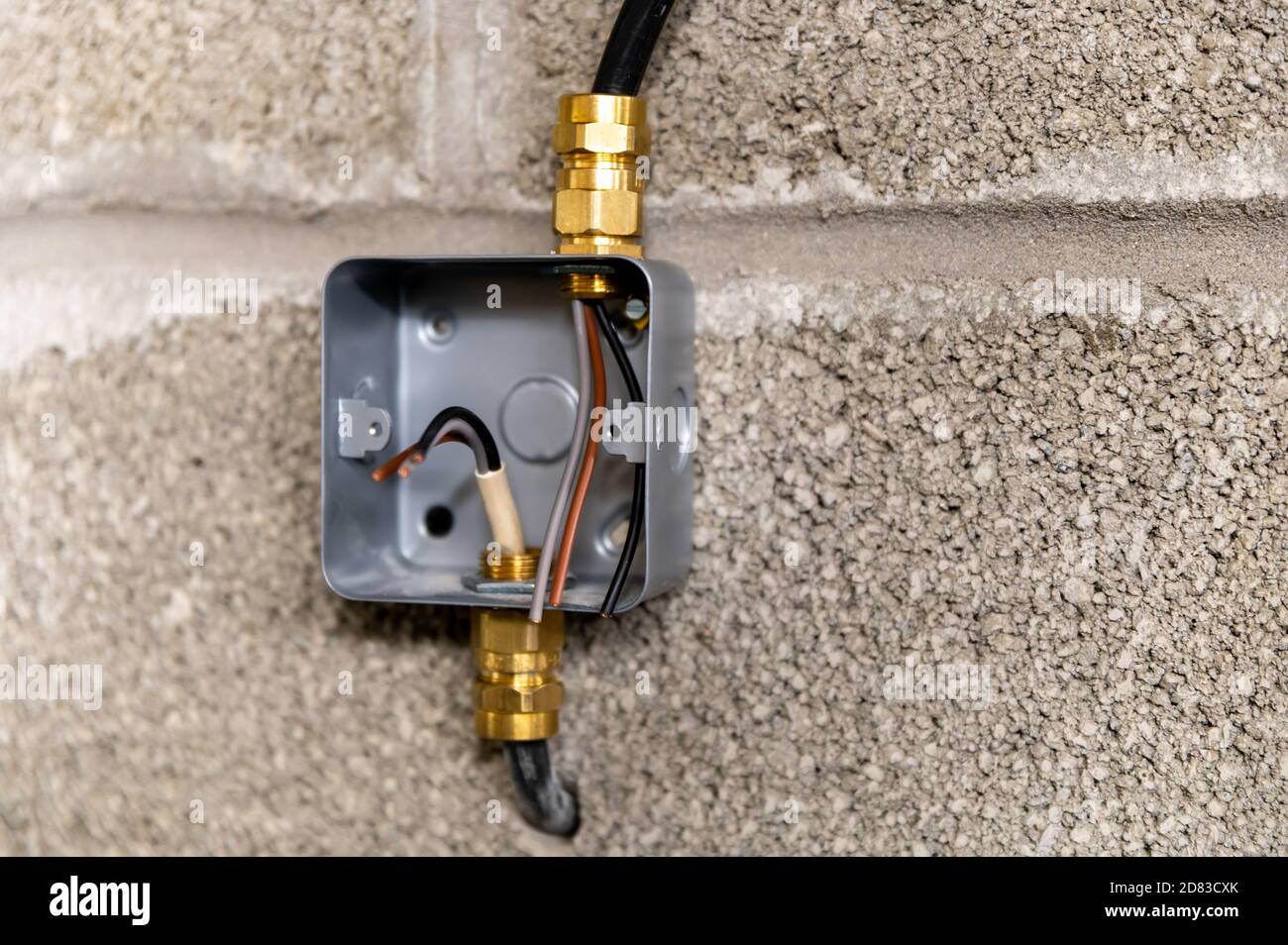 Isolated metal box socket outer case on garage wall ready to be wired ...