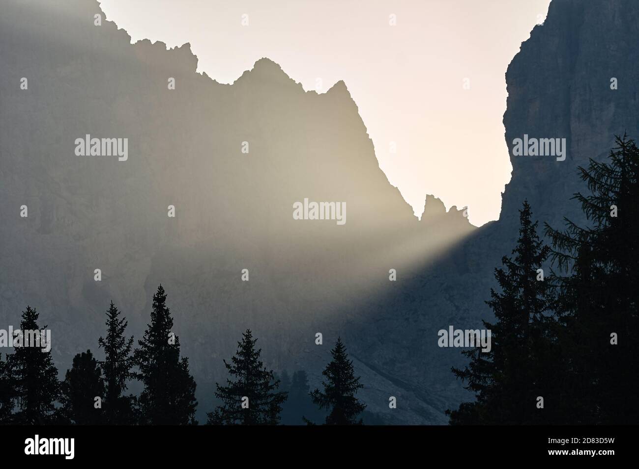 Sunrise between mountain cliffs Stock Photo - Alamy