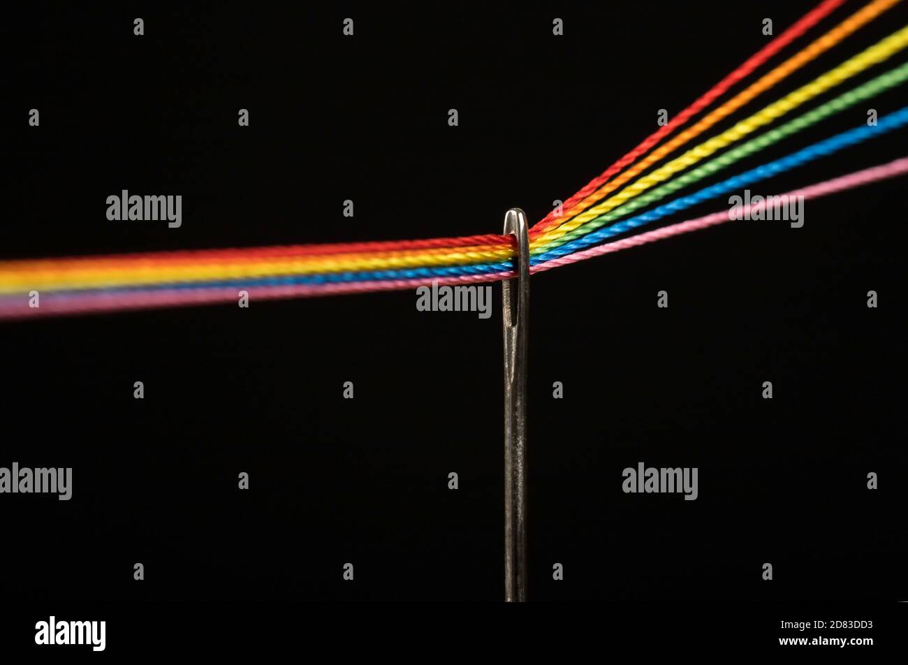 color spectrum thread and needle Stock Photo - Alamy