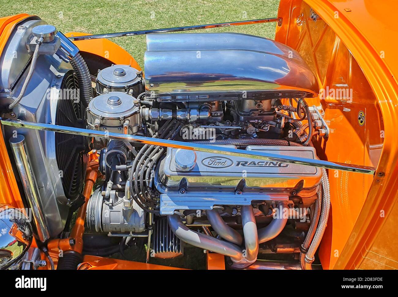 The engine of a Ford Racing orange hot rod at the Lake Mulwala Rod Run ...