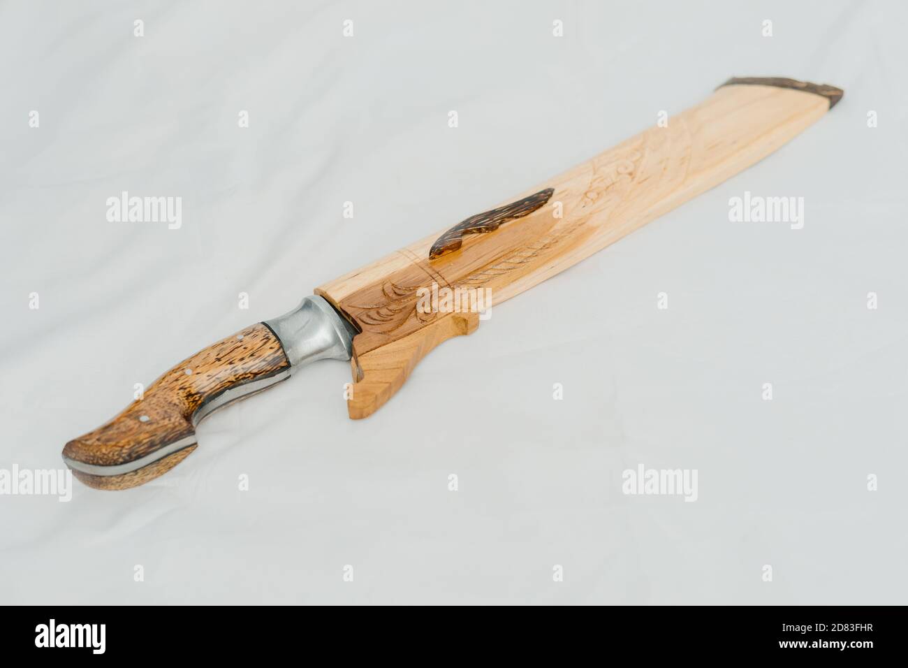 Indonesian traditional weapon called golok with carved wooden case ...