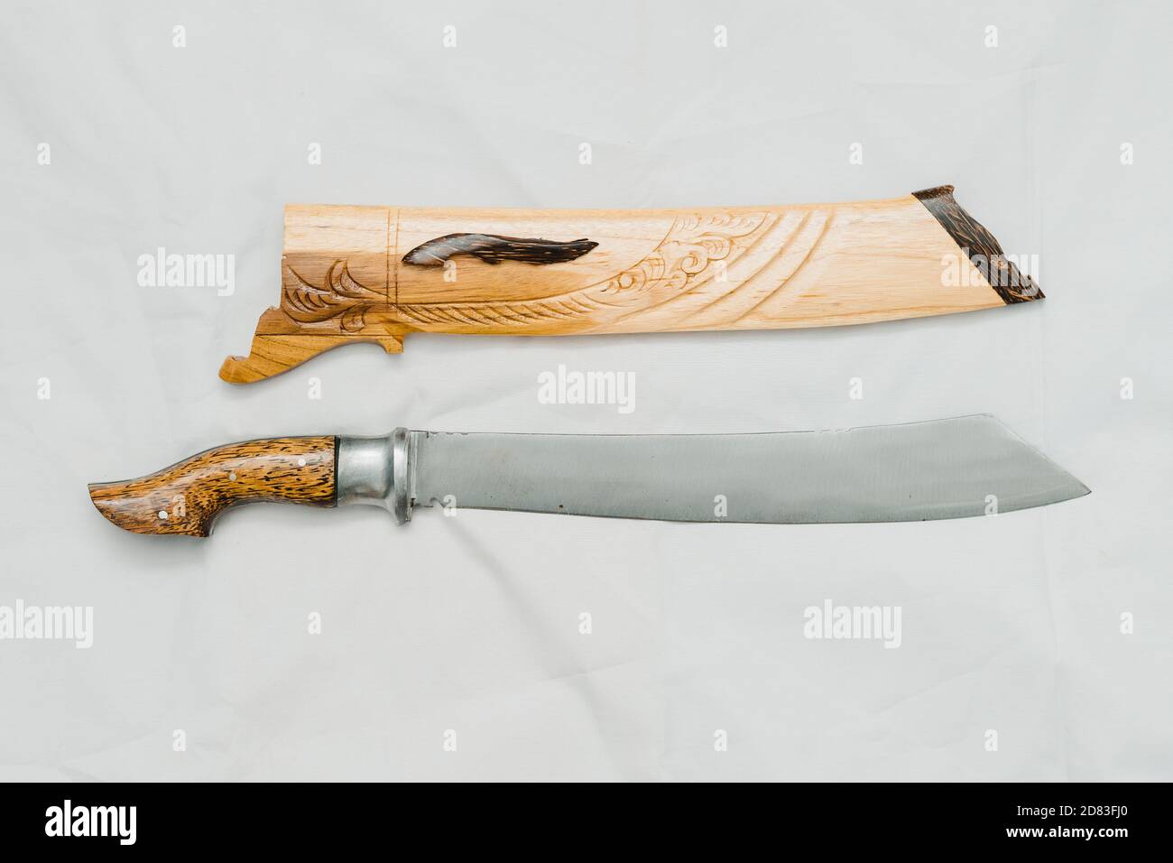 Indonesian traditional weapon called golok with carved wooden case ...