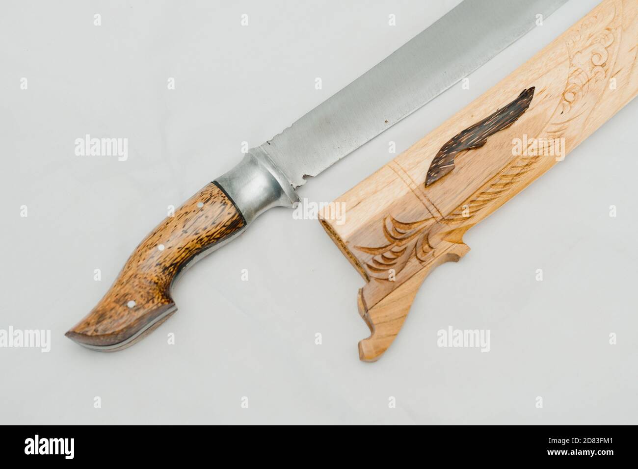 Indonesian traditional weapon called golok with carved wooden case ...