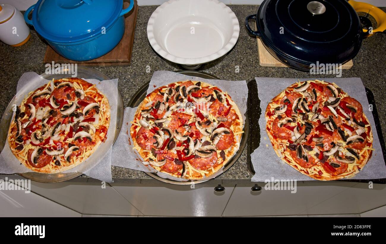 Three Home Made Pizzas on the Bench Stock Photo - Alamy