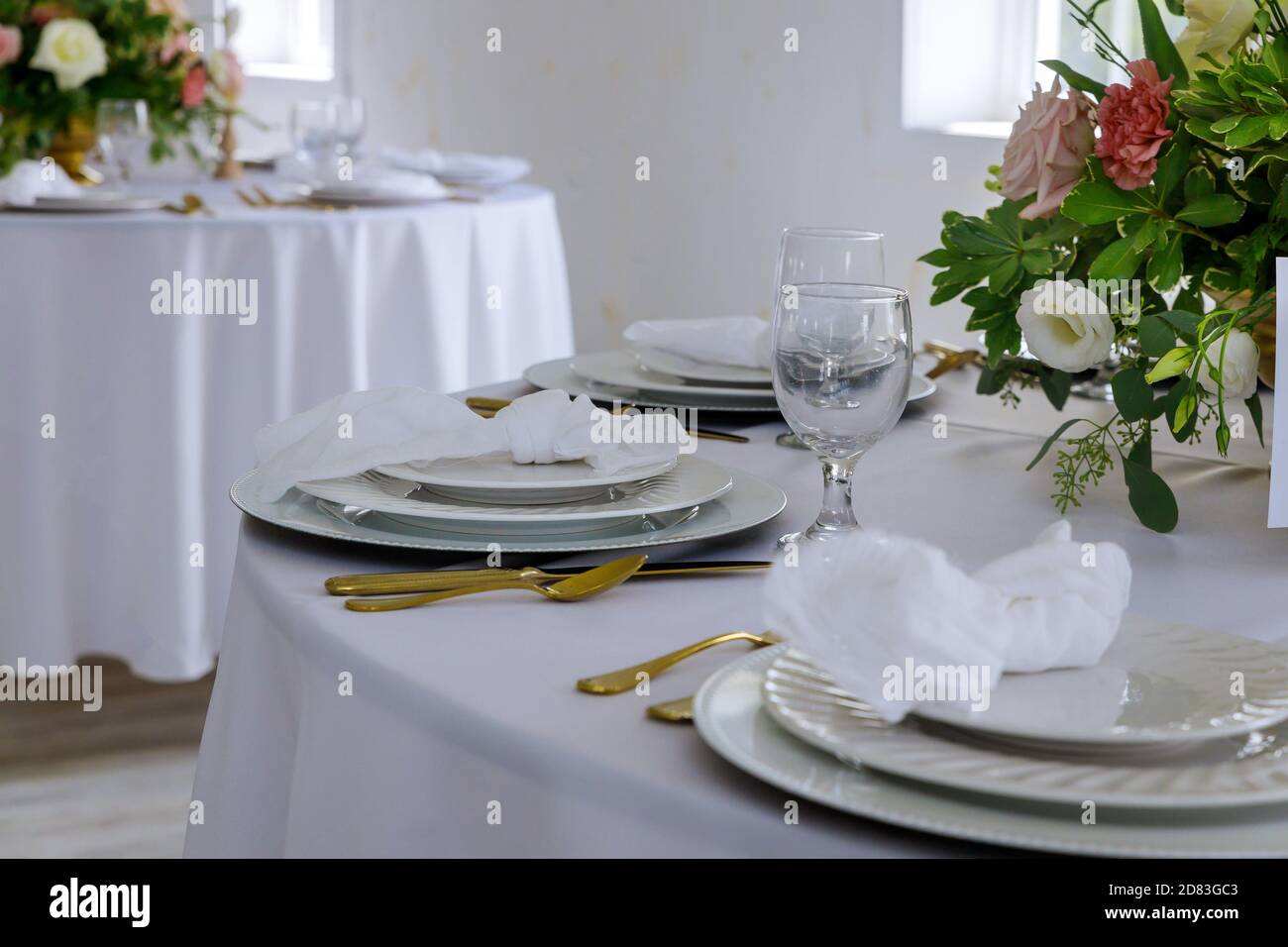 Table set for wedding or another party. Flowers arrangement Stock Photo ...