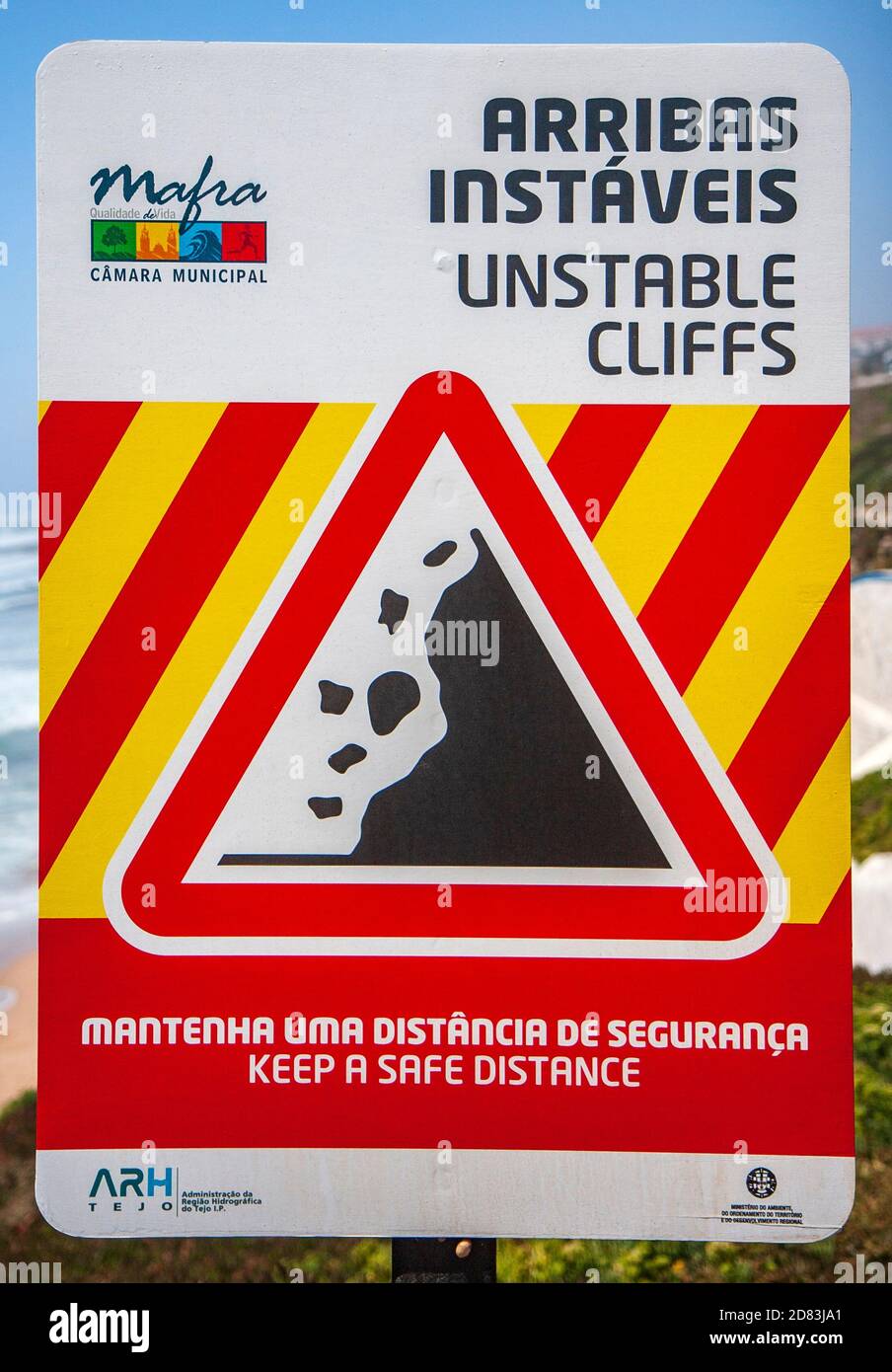 Sign warning for unstable cliffs above the beach area of the town of ...