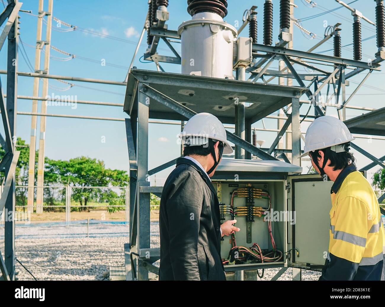 Businessmen and engineers are talking about problems and electricity ...