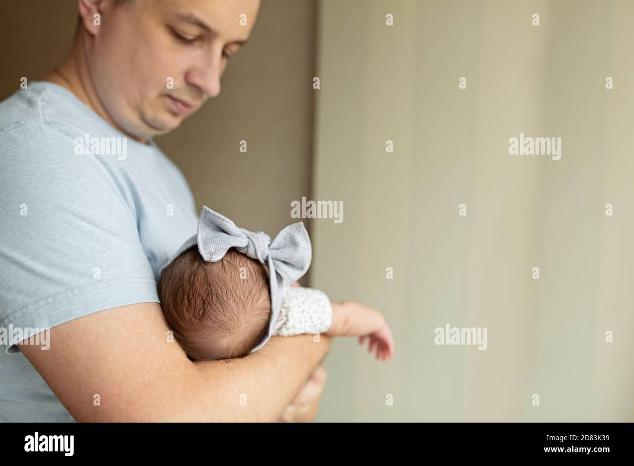 Young Caucasian father holding newborn baby girl. Male man parent and ...