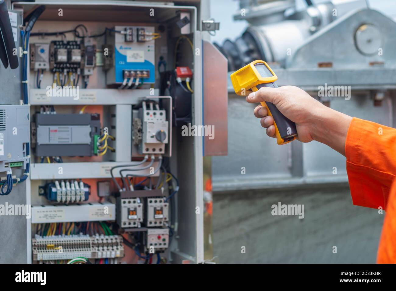 Engineers used a Thermo gun for checking the temperature of the ...