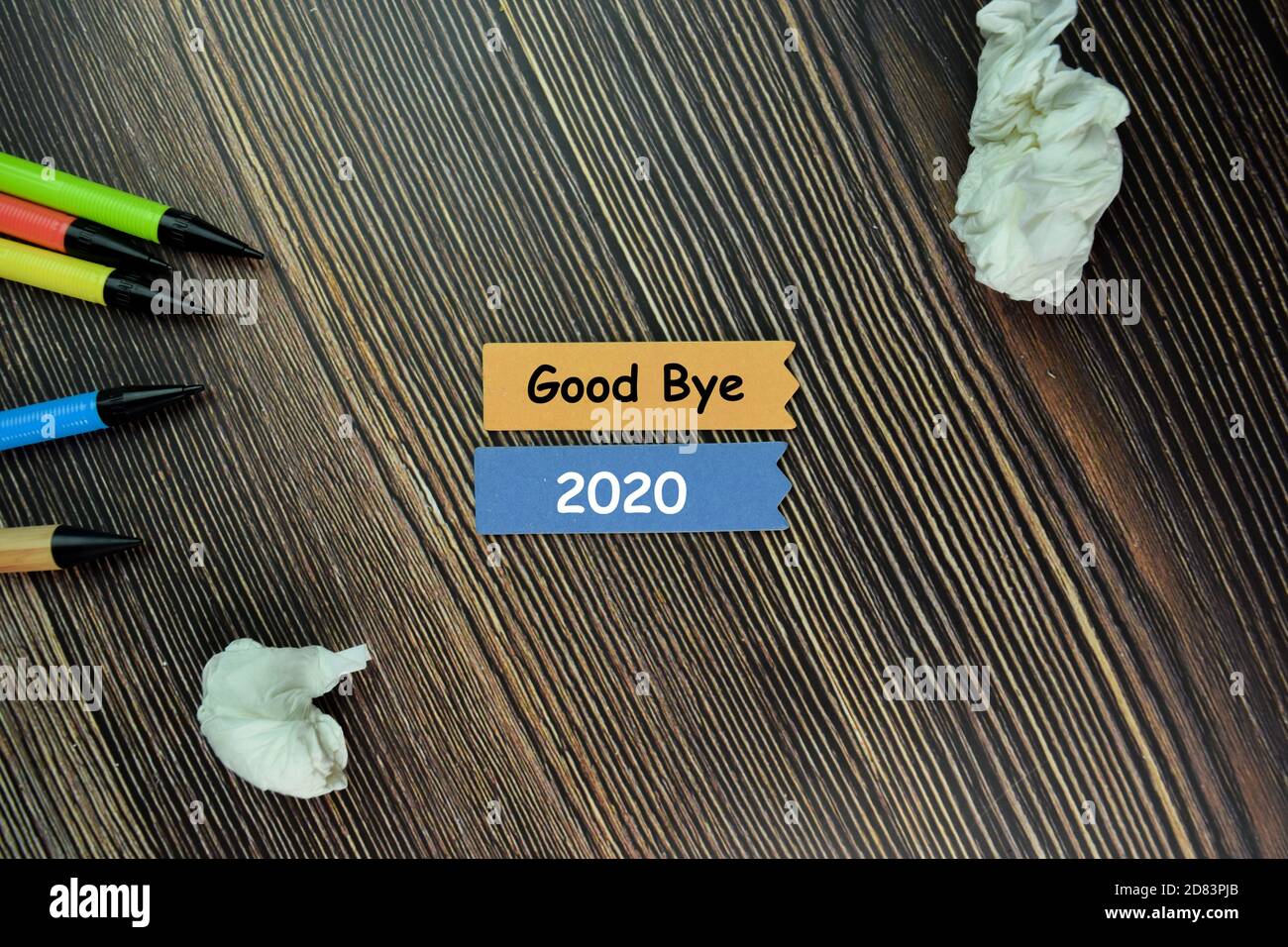 Good Bye 2020 write on sticky note and isolated on Wooden Table. New ...