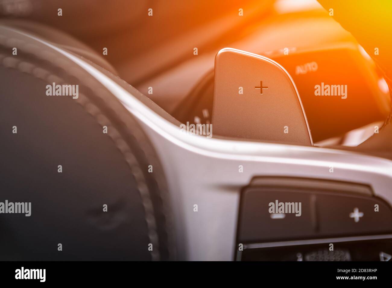 Vehicle interior of a modern car with voice control button. Steering ...