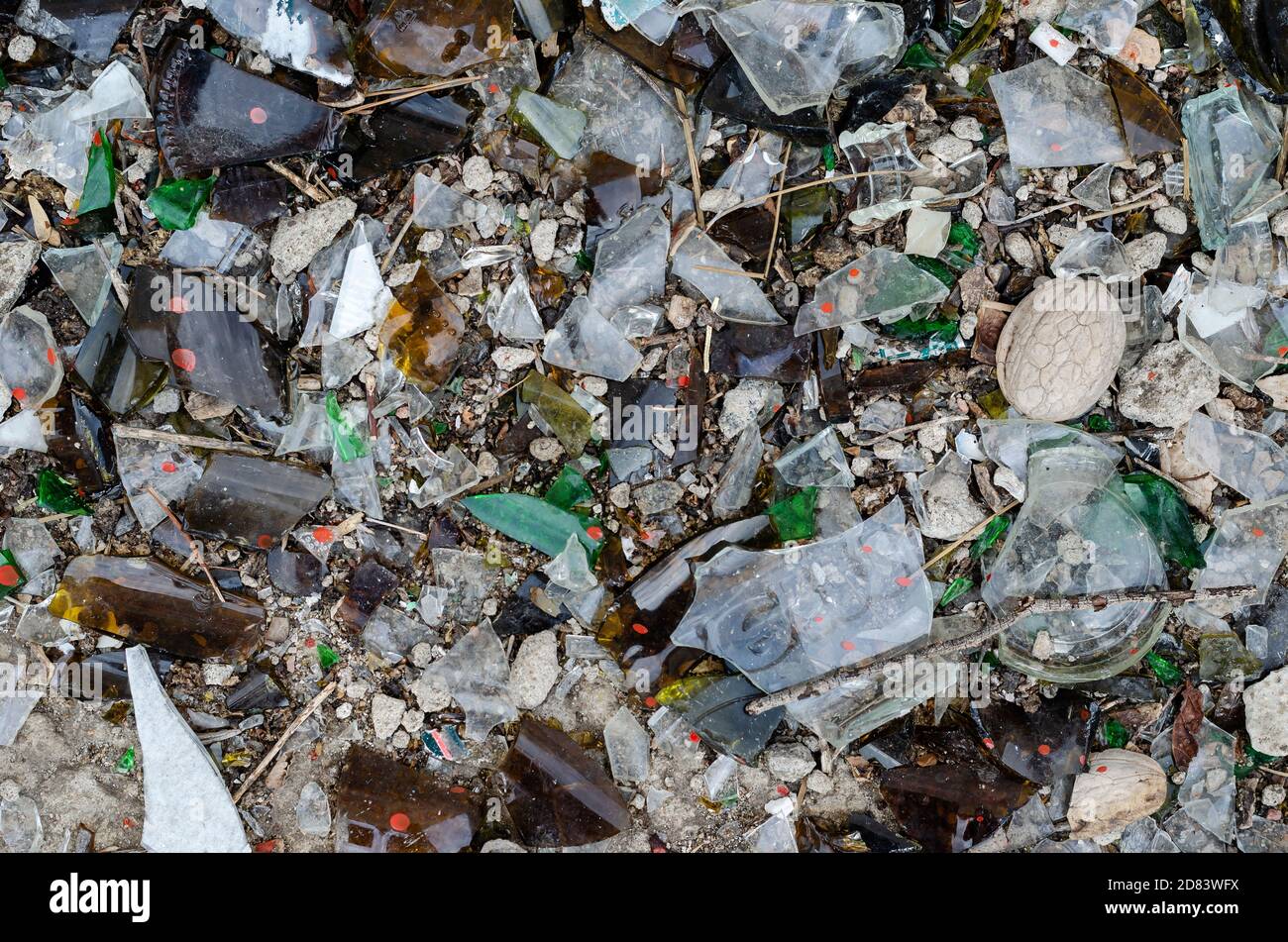 Random pieces of broken glass on the ground. Colored glass pieces mixed ...