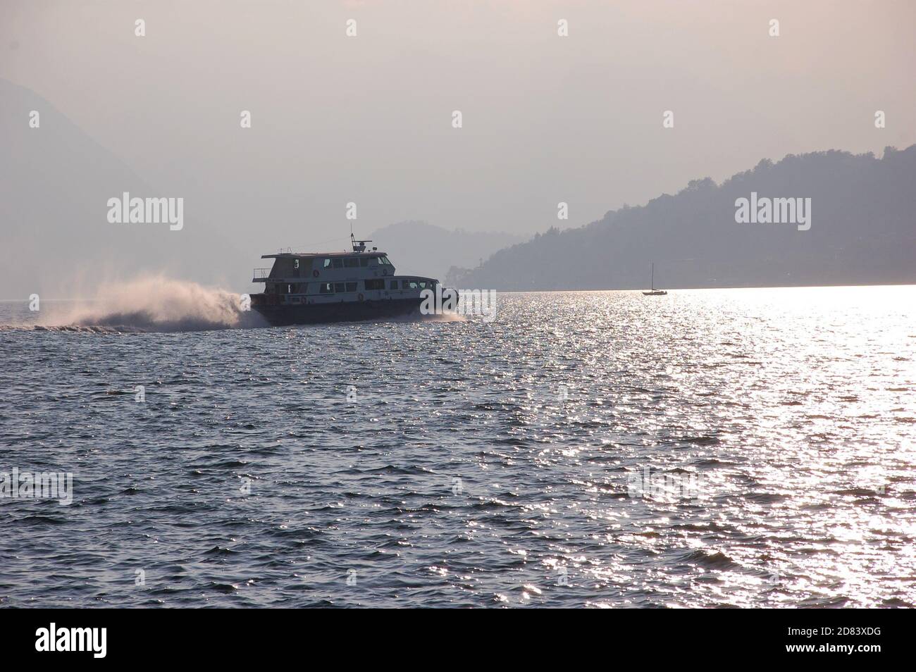 passenger craft crossing speedy the lake of Como leaving from Varenna ...