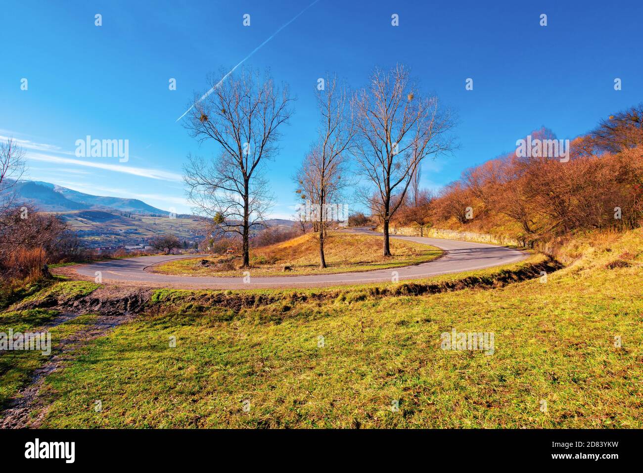country road in autumn. morning scenery in mountainous rural area ...