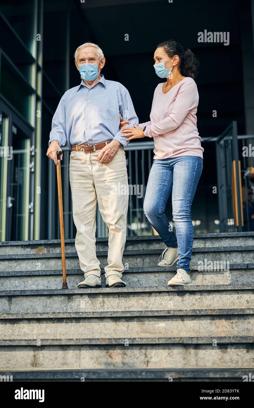 Helping down stairs hi-res stock photography and images - Alamy