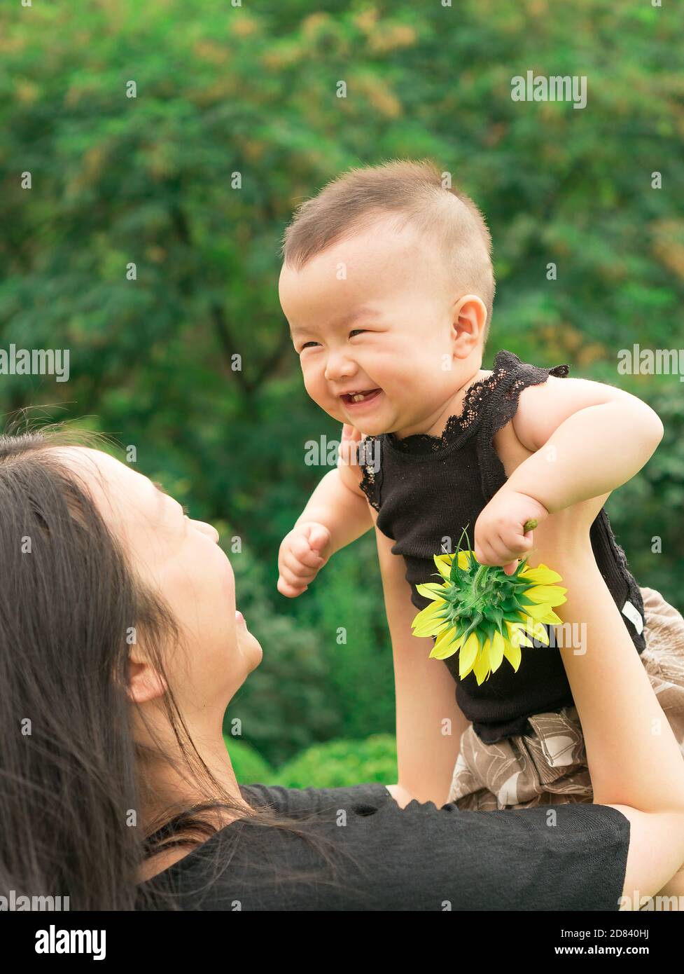Newborn baby mother family hold child park outdoors hi-res stock ...