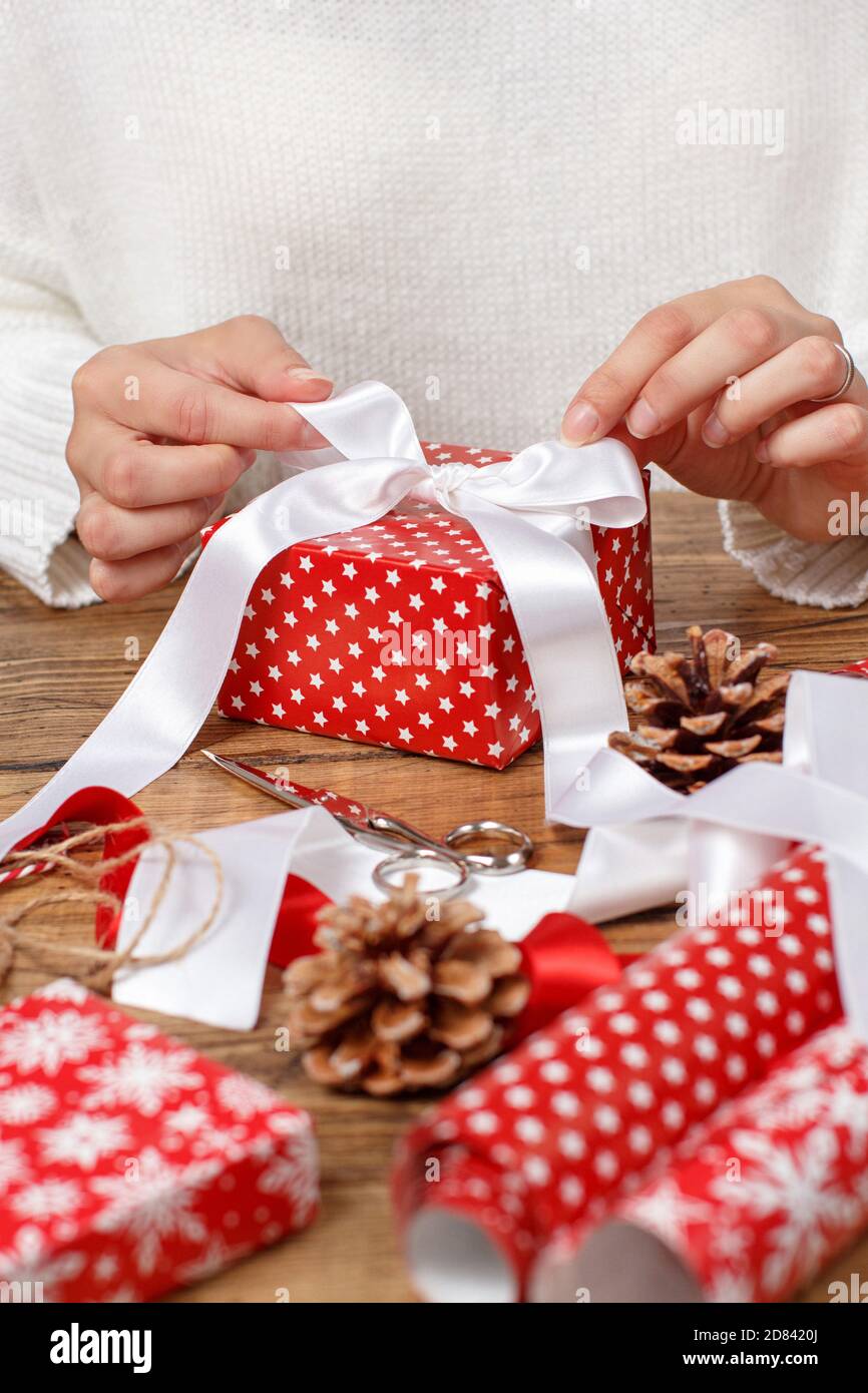 Woman ties ribbon bow on hi-res stock photography and images - Alamy