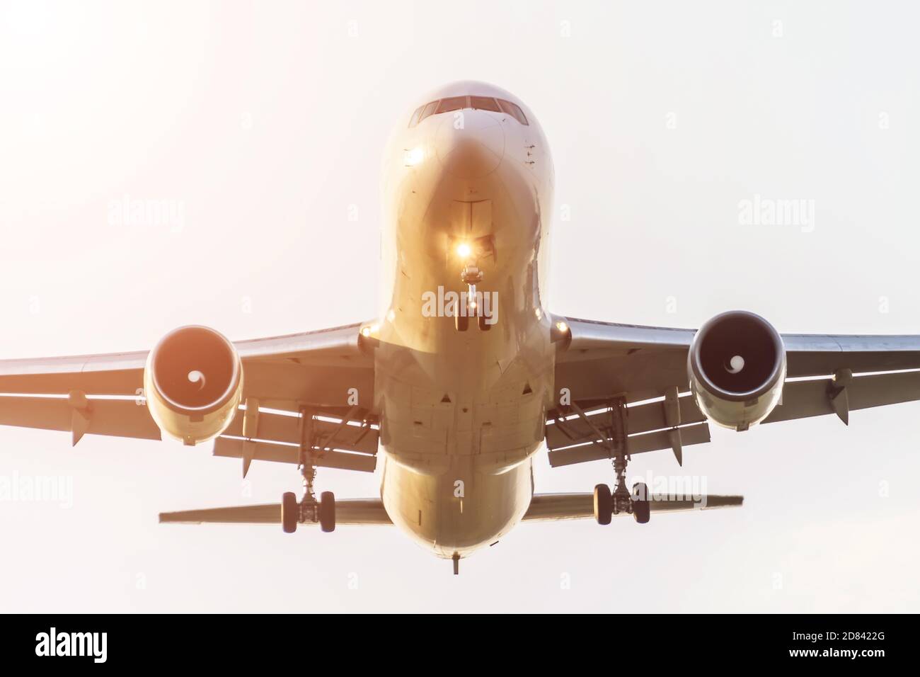 Passenger plane flies in sunset hi-res stock photography and images - Alamy