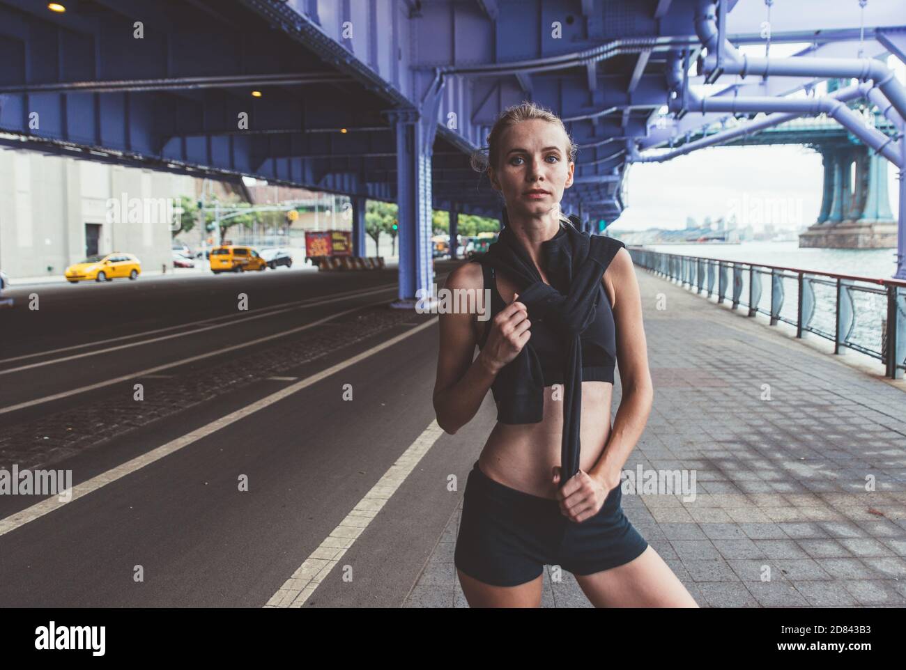 Group of urban runners running on the street in New york city ...