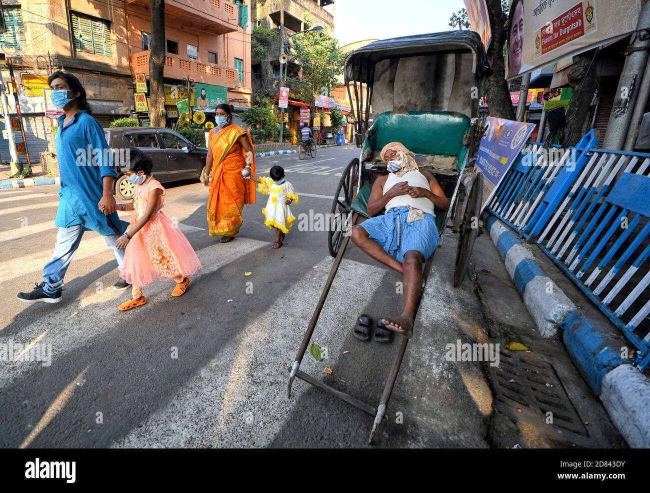 Kolkata, India. 26th Oct, 2020. A hand pull Rickshaw Driver wearing a ...