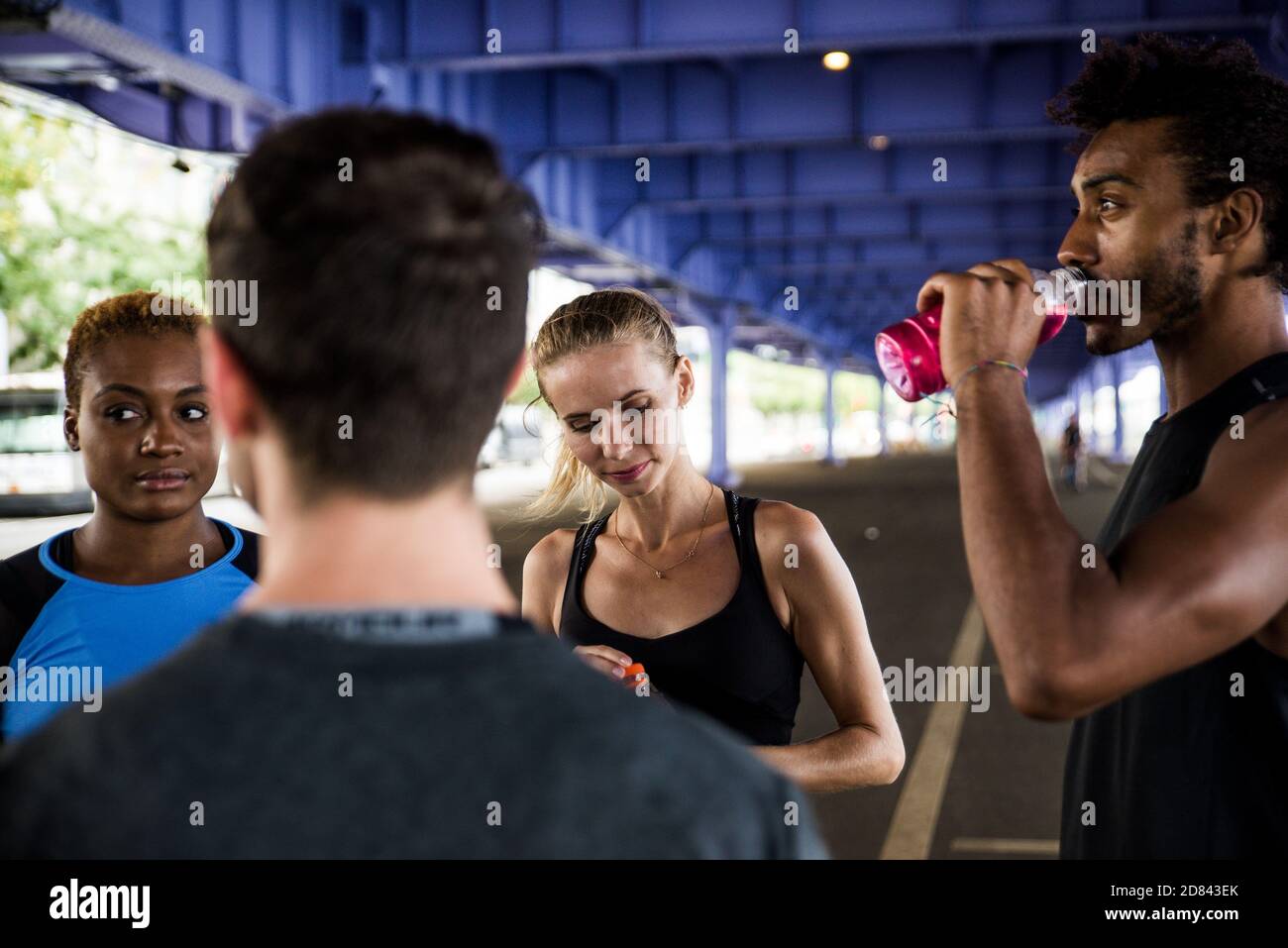 Group of urban runners running on the street in New york city ...