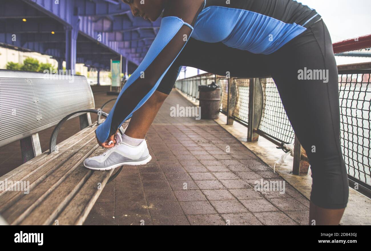 Group of urban runners running on the street in New york city ...