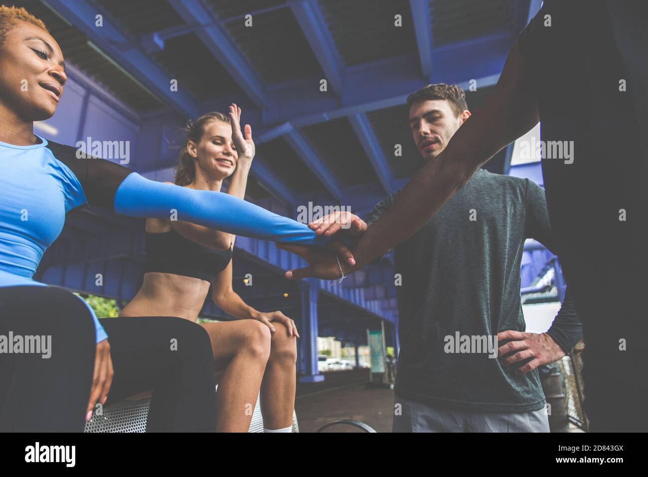 Group of urban runners running on the street in New york city ...