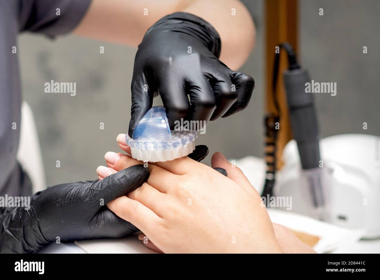 Woman polishing fingernails hi-res stock photography and images - Alamy