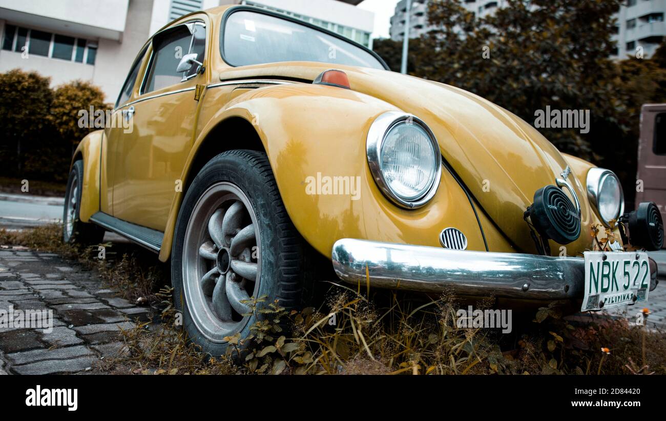 A car parked on a grassy roadside A car parked on a grassy roadside ...