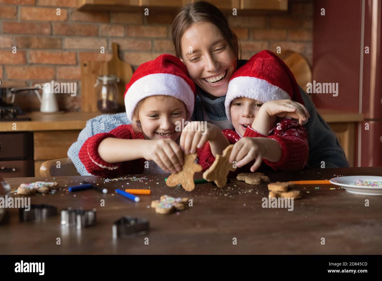 Loving mom have fun baking biscuits with kids Stock Photo - Alamy