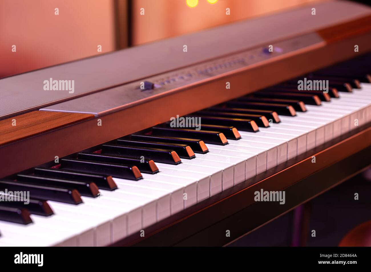 Piano keys on a beautiful colored background. Close up Stock Photo - Alamy