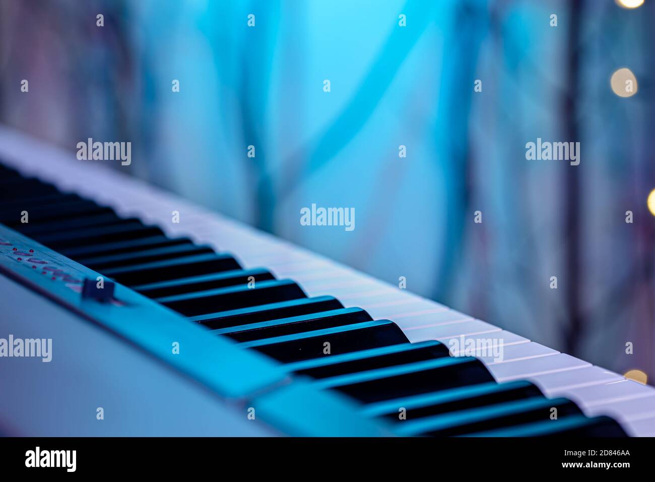 Piano keys on a beautiful colored background. Close up Stock Photo - Alamy
