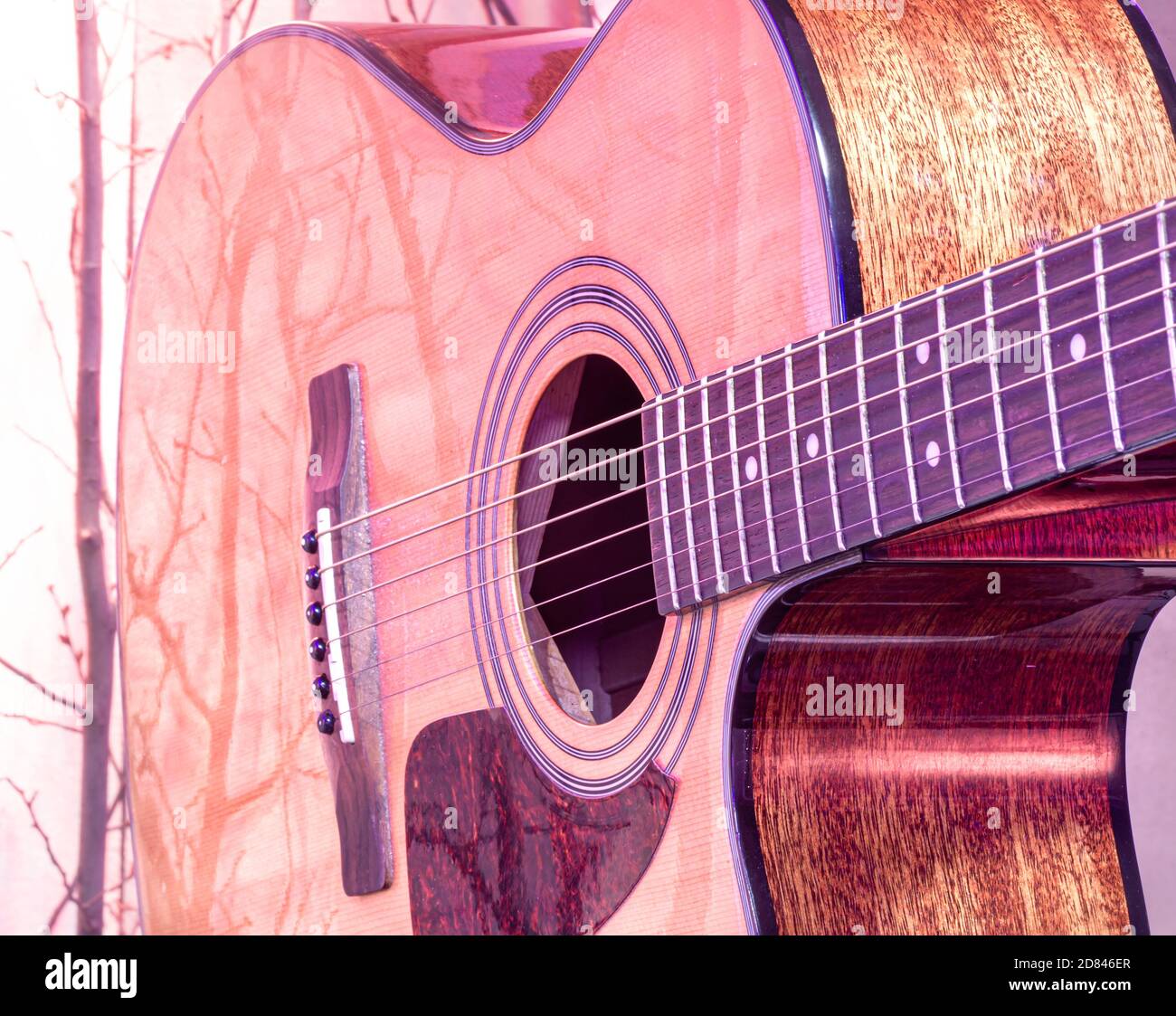 Acoustic guitar on a beautiful colored background. The concept of ...